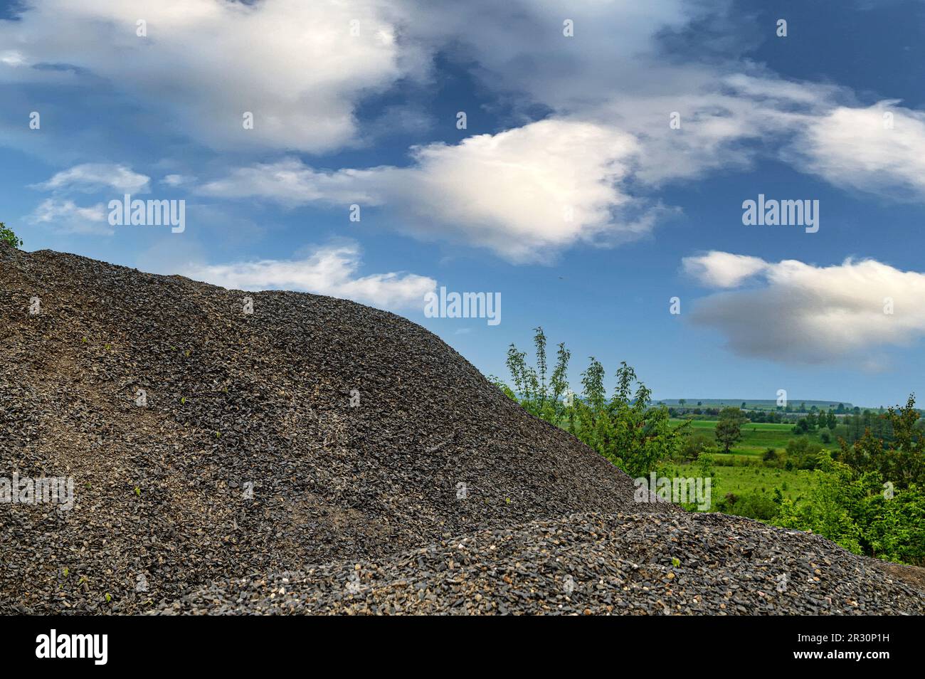 Small gravel from granite. A large pile of building basalt in a quarry ...