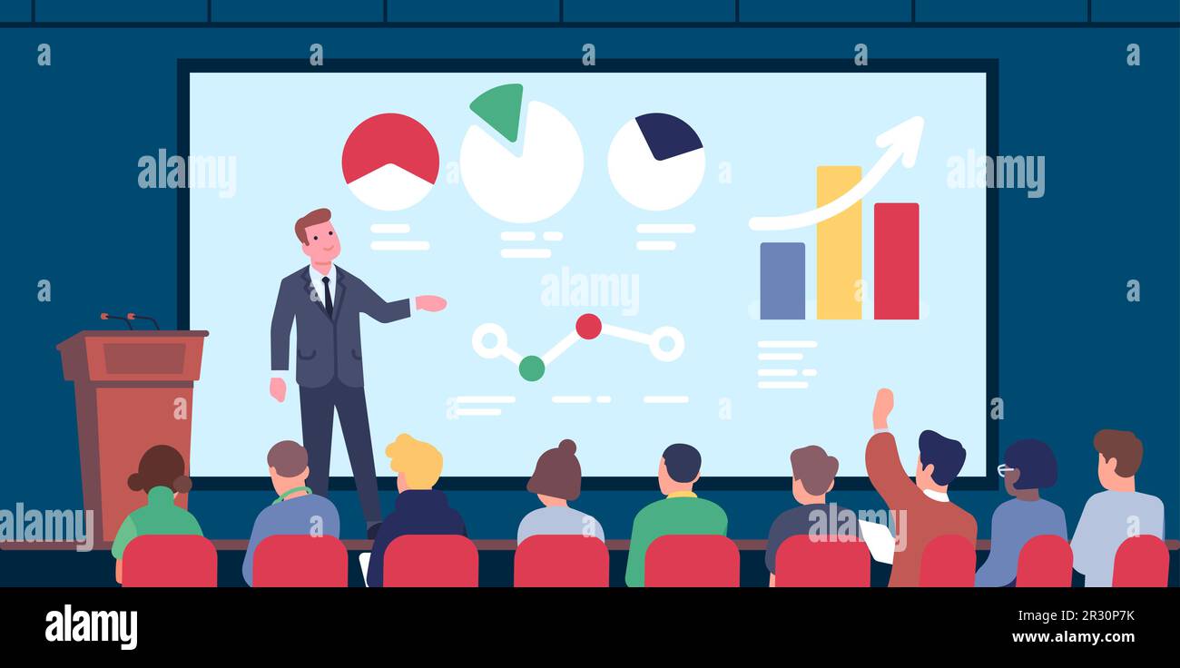 Speaker on stage in front of big screen answers questions from people ...