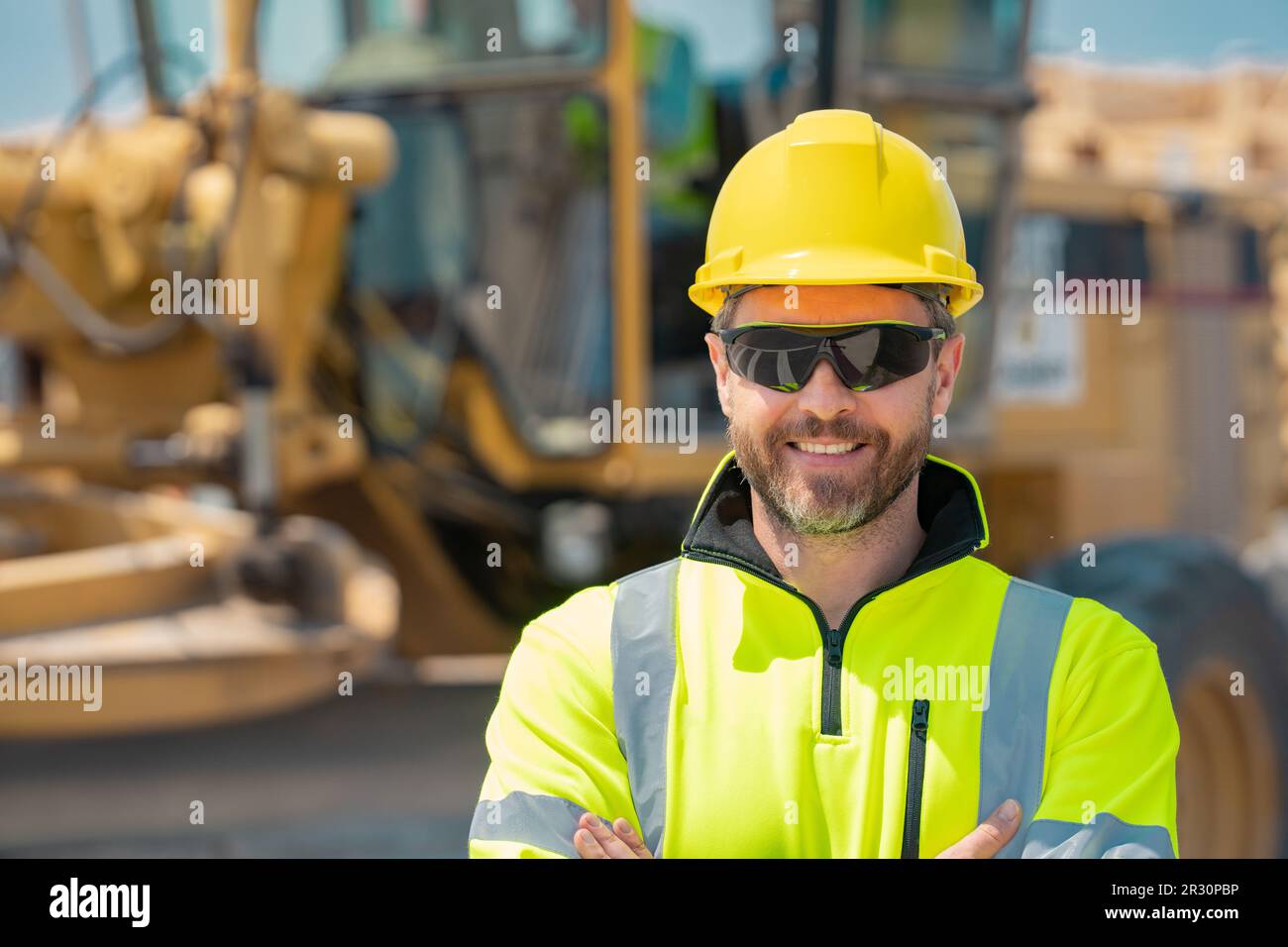 Construction worker at house under construction. Builder in building ...