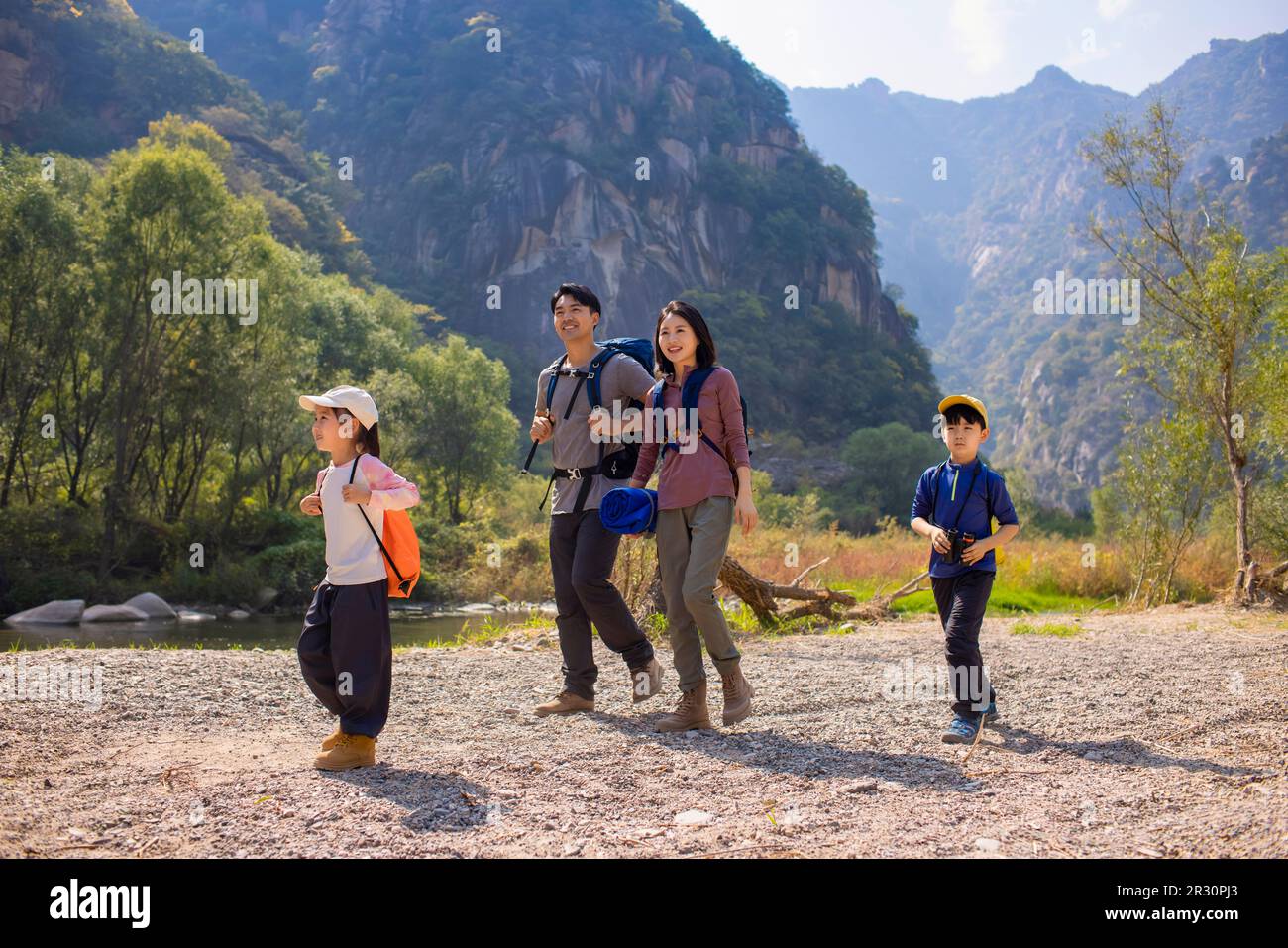 Happy young Chinese family hiking outdoors Stock Photo - Alamy