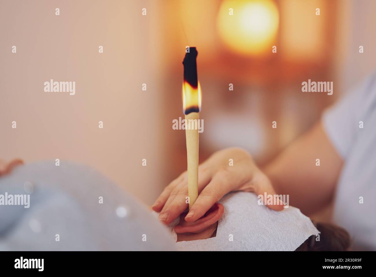 Picture of woman having candle therapy concha Stock Photo - Alamy