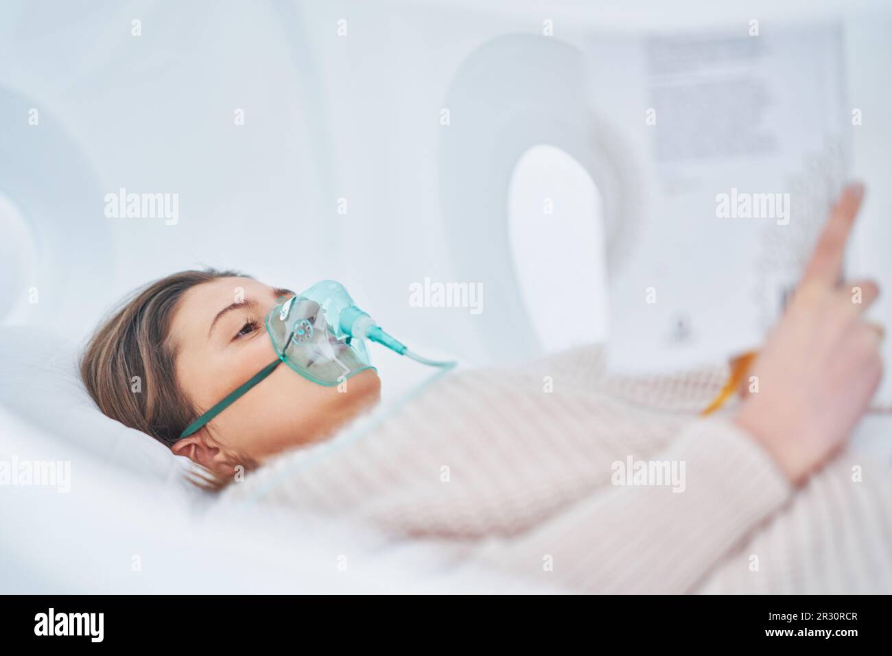 Picture of brunette woman in oxygen cabin Stock Photo - Alamy
