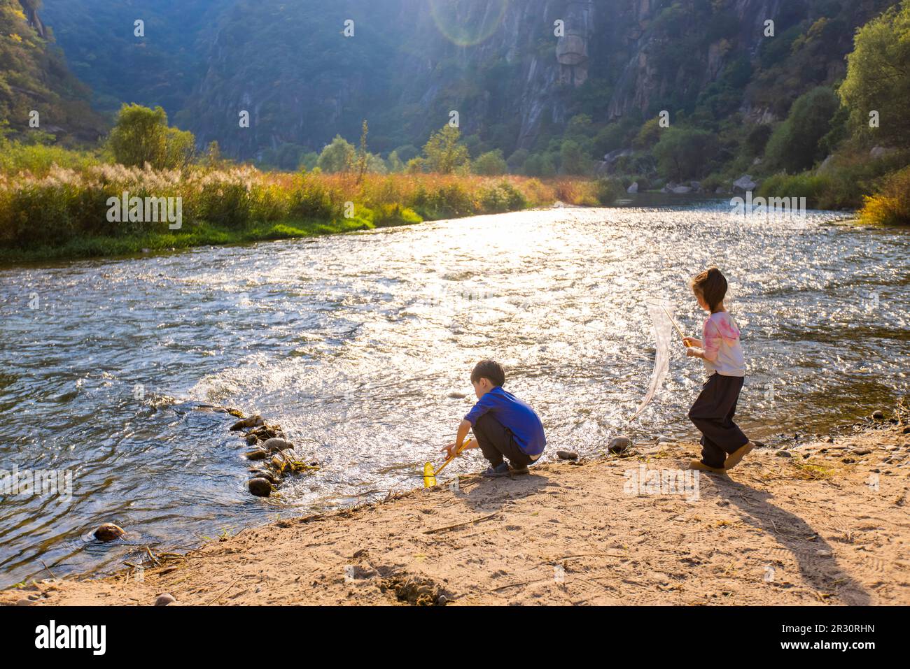 Cute Chinese Children having fun outdoors Stock Photo - Alamy