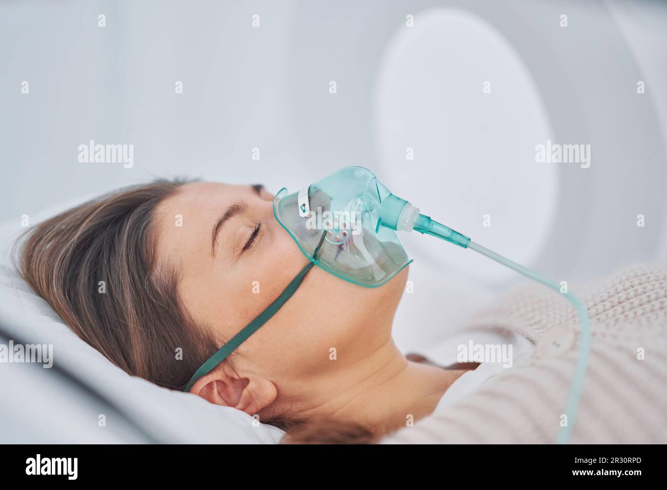 Picture of brunette woman in oxygen cabin Stock Photo - Alamy