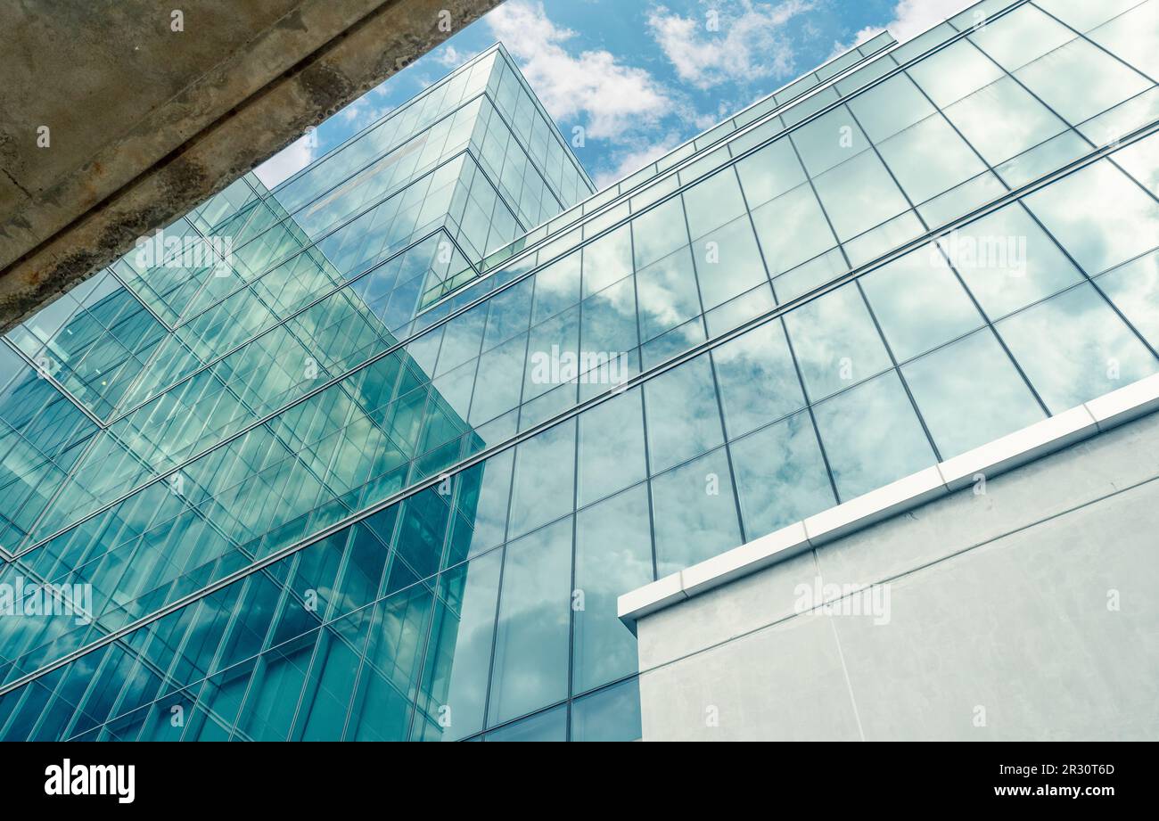 Modern sustainable glass office building. Exterior view of corporate ...