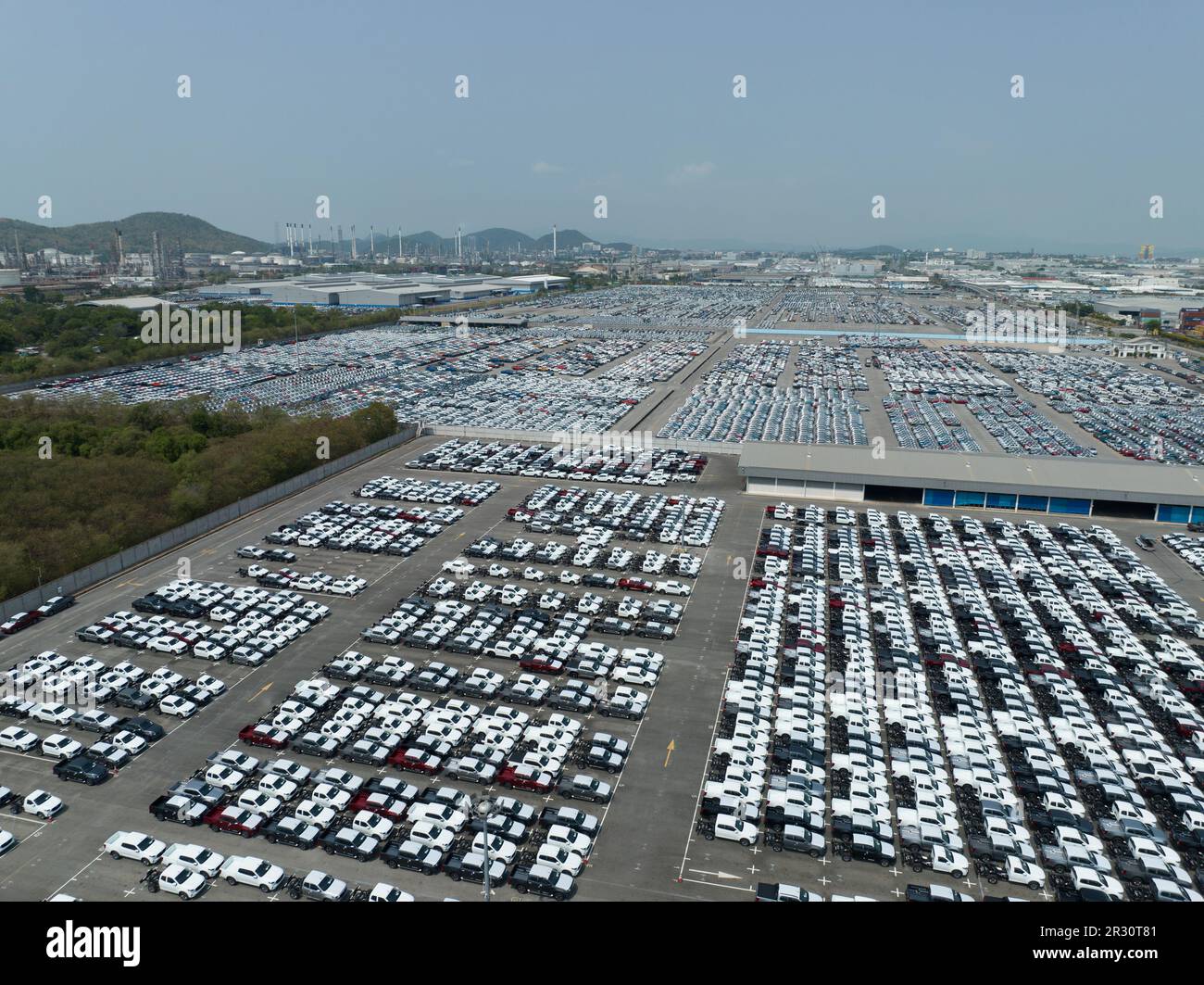 Aerial view of new cars stock at factory parking lot. Above view cars ...
