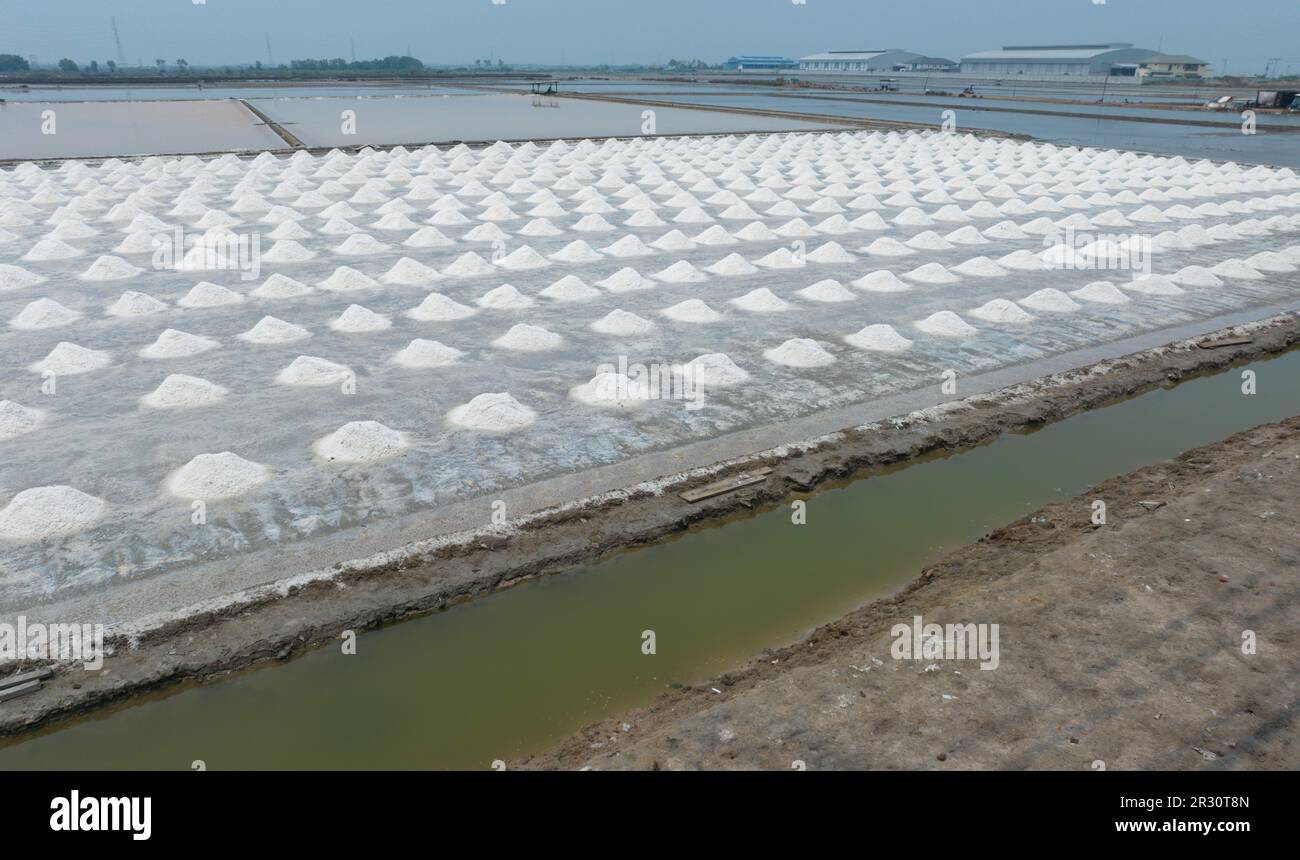 Aerial view of sea salt farm. Pile of brine salt. Raw material of salt ...