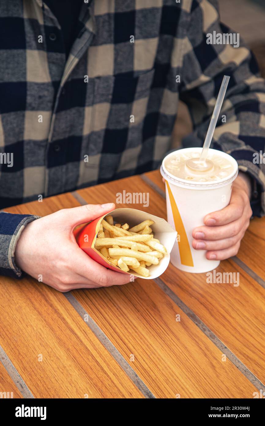 Kid hand french fries hi-res stock photography and images - Alamy
