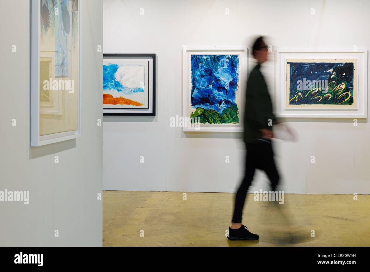 Man Walking and Admiring Paintings in a Modern Art Gallery Stock Photo ...