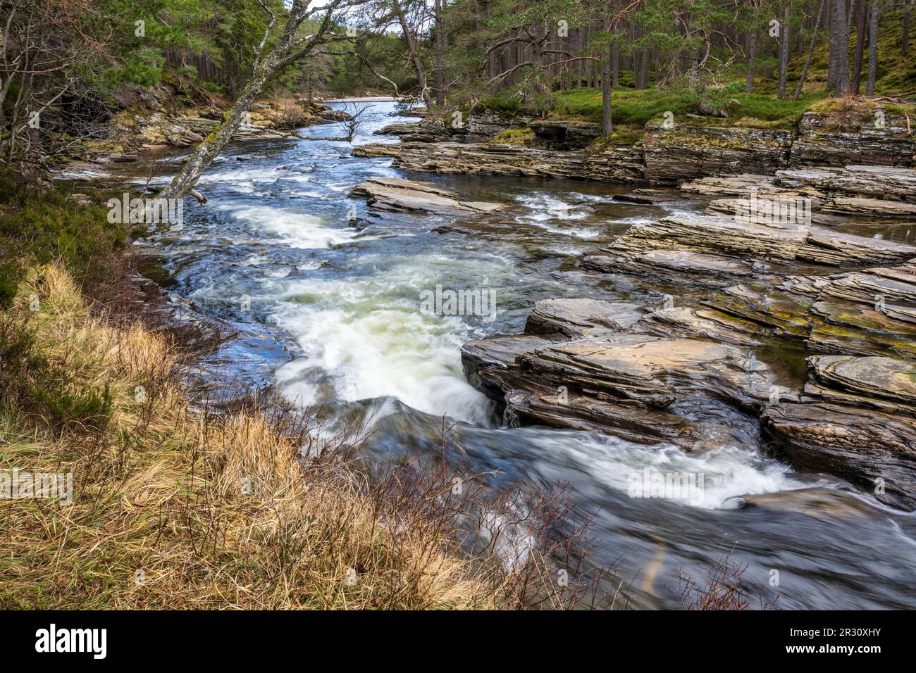 The fast-flowing River Dee downstream of The Linn O’ Dee near Braemar ...