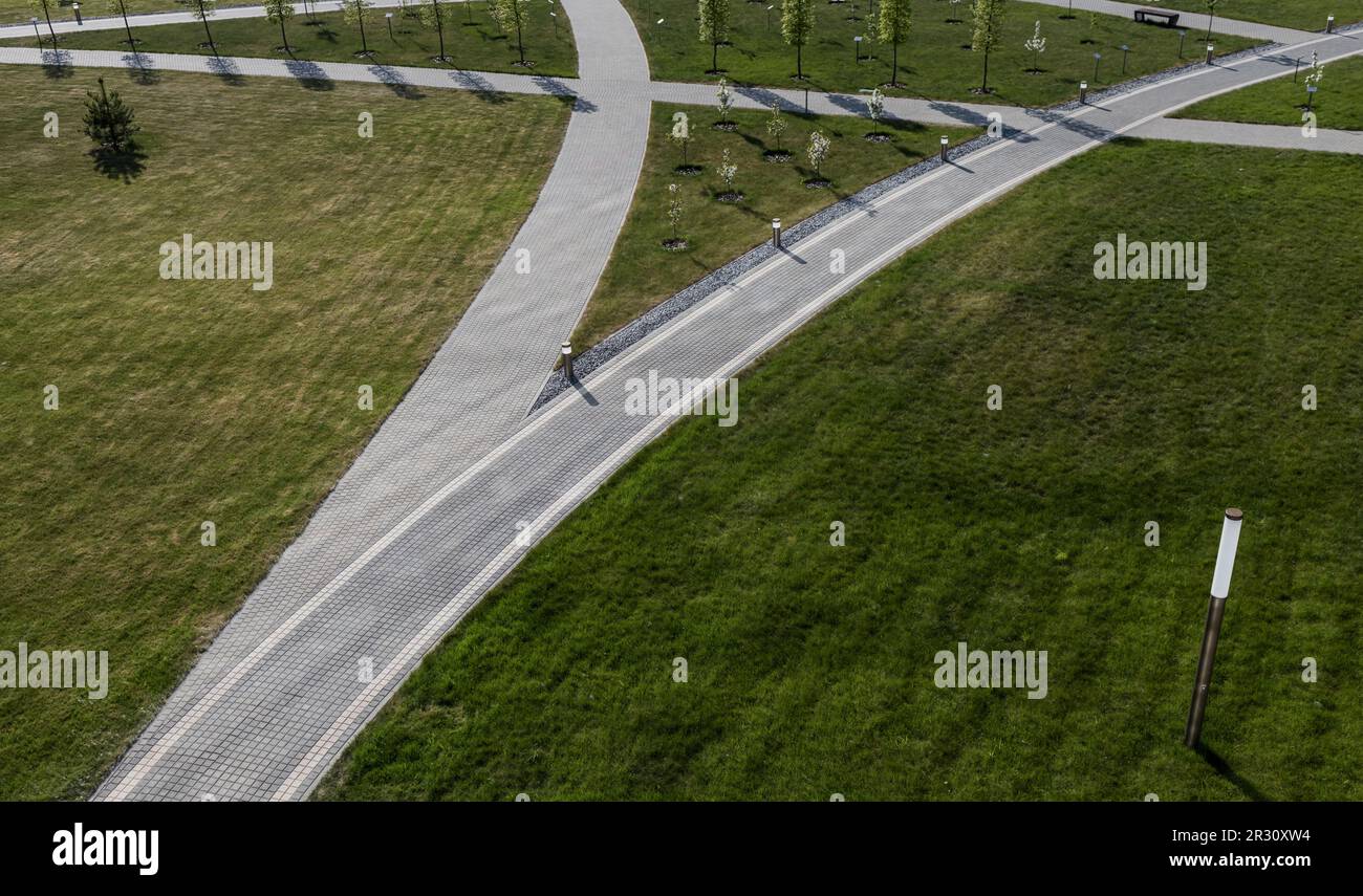 Curved Garden Path With Fresh Green Cultivated Lawn And Trees View From A Height Landscaping