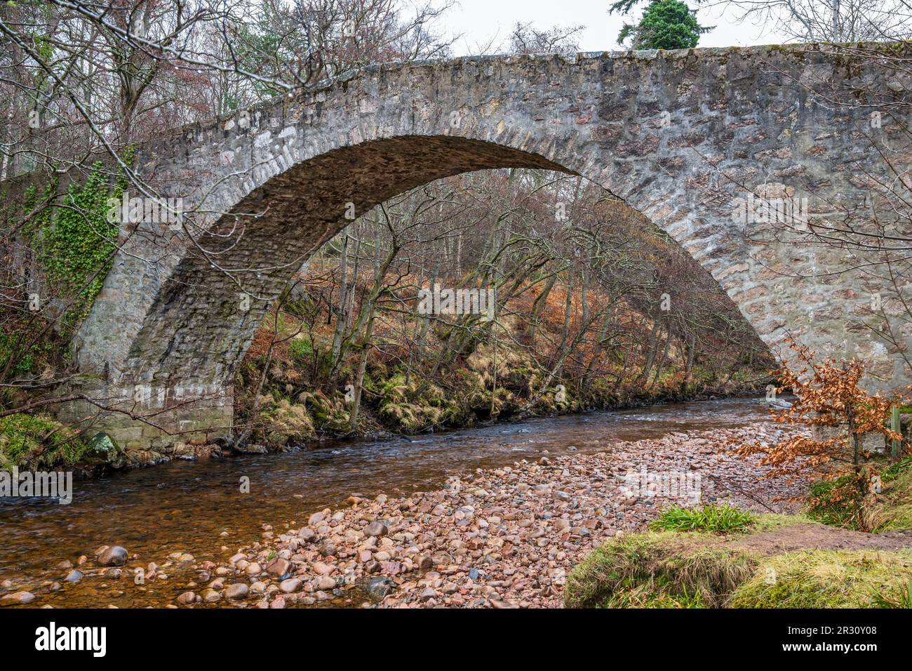 Stone arch bridge over Water of Tanar in Glen Tanar Estate near Aboyne ...