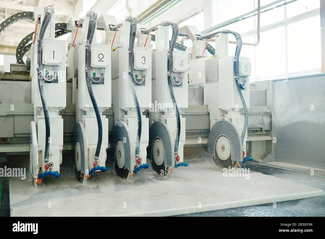 Horizontal image of big machine with sharp discs for cutting marble in ...