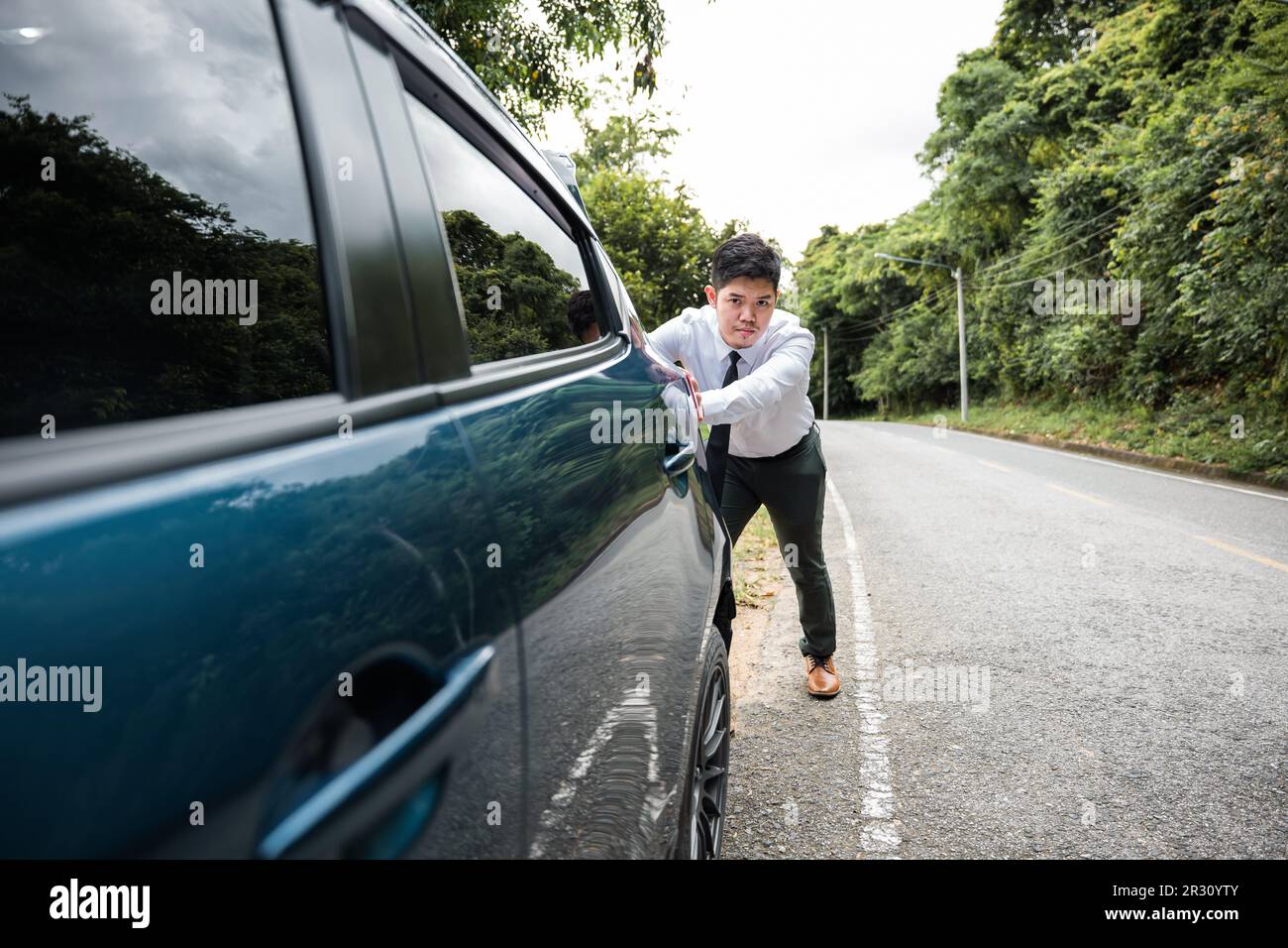 Asian businessman car broken has problems with car down during go to ...