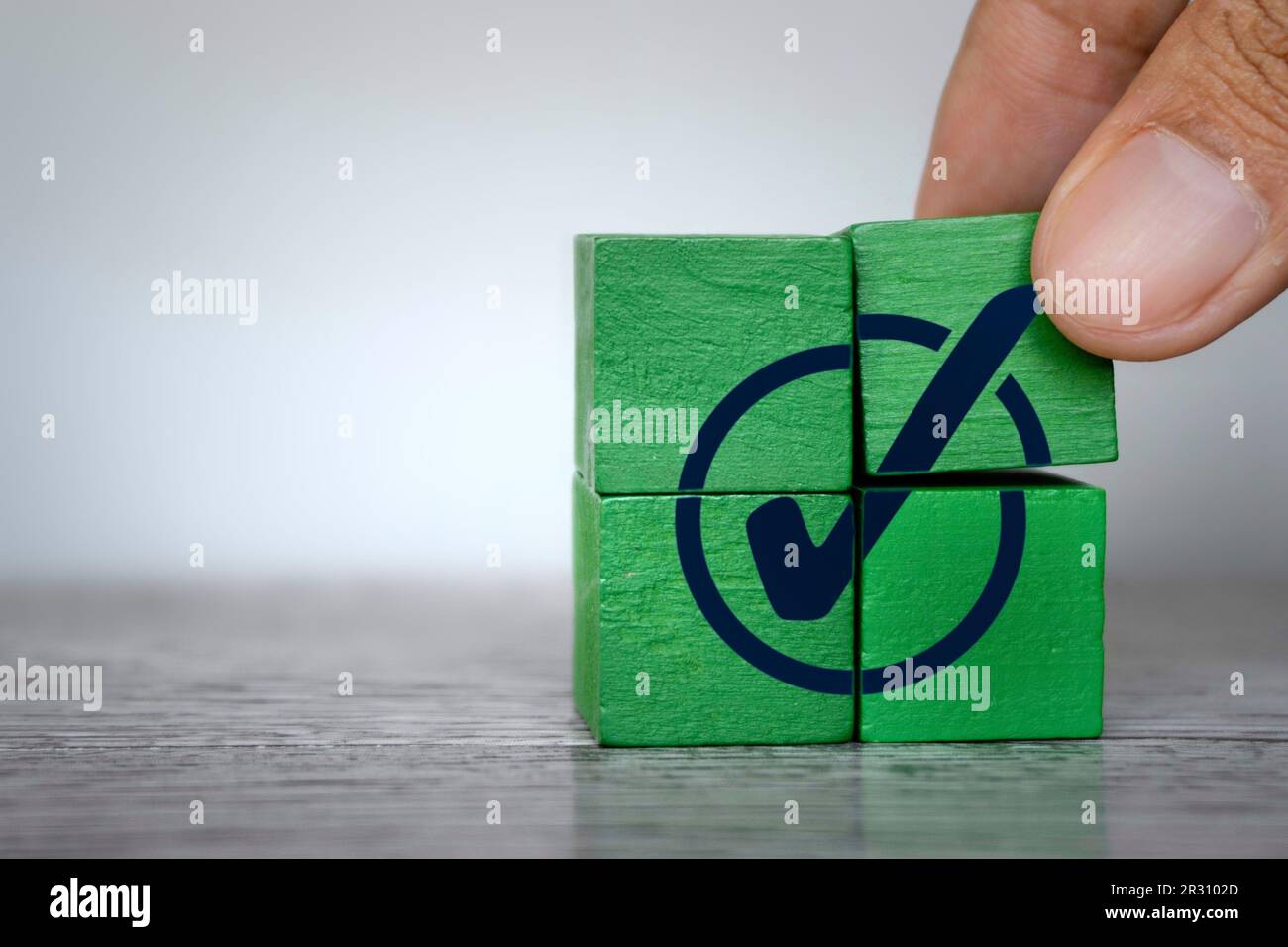 Green wooden cubes with checkmark icon. Corporate regulatory compliance ...