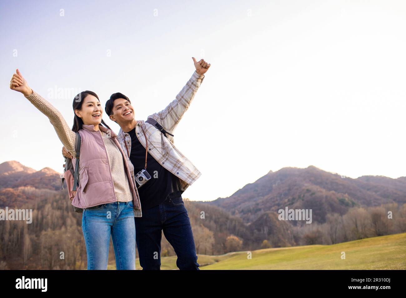 Cheerful young couple enjoying the beautiful natural scenery Stock ...