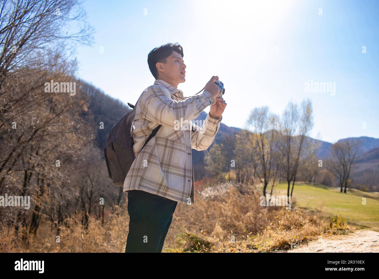 Cheerful photographer enjoying the beautiful natural scenery Stock ...