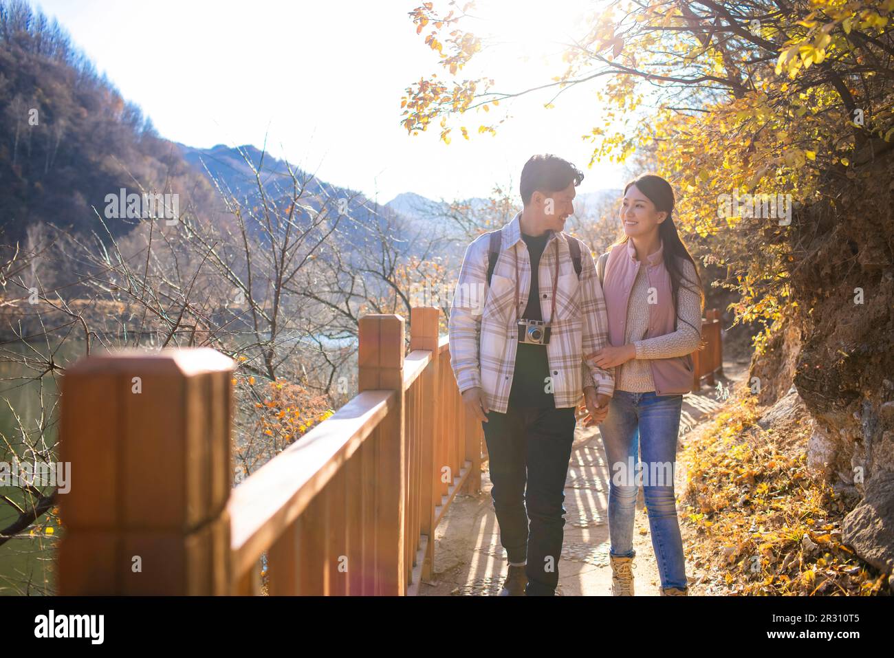Cheerful young couple enjoying the beautiful natural scenery Stock ...