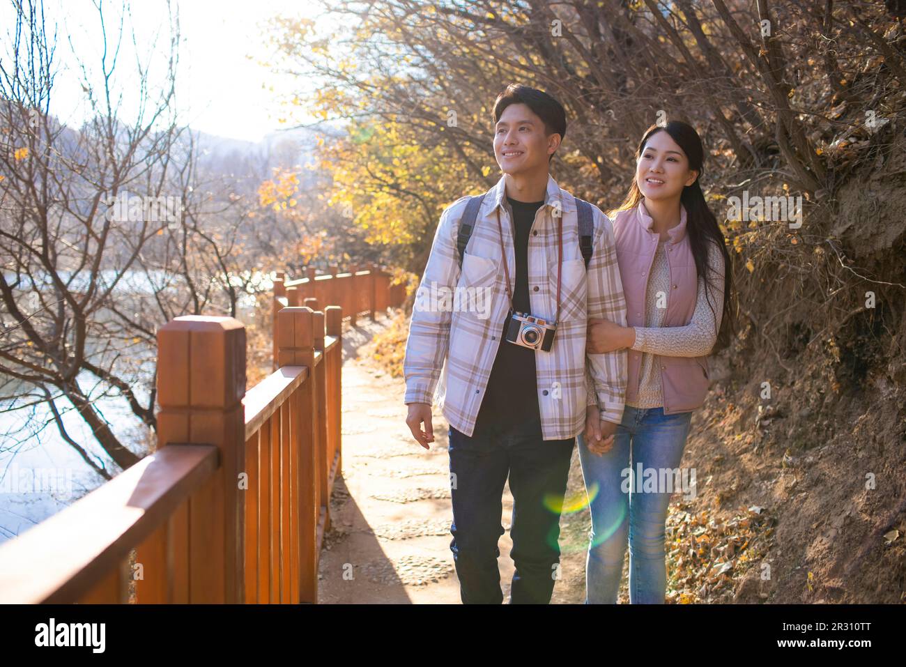 Cheerful young couple enjoying the beautiful natural scenery Stock ...