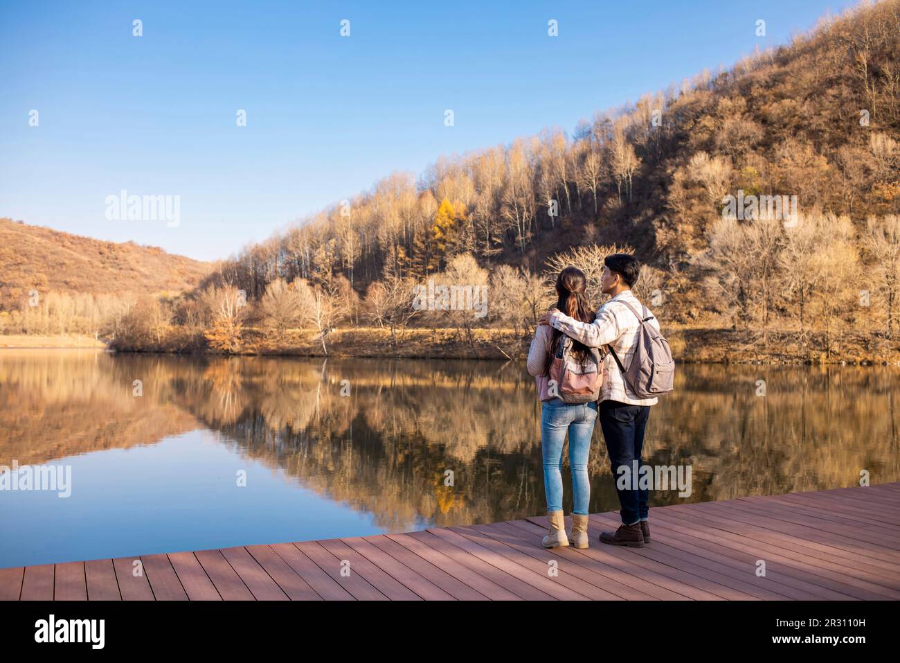 Cheerful young couple enjoying the beautiful natural scenery Stock ...