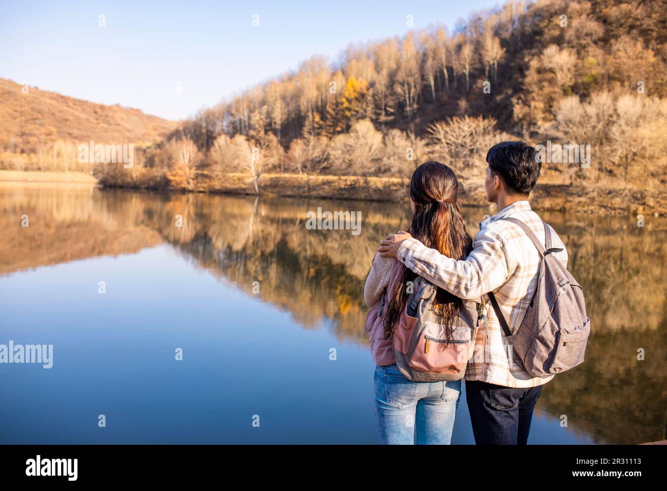 Cheerful young couple enjoying the beautiful natural scenery Stock ...