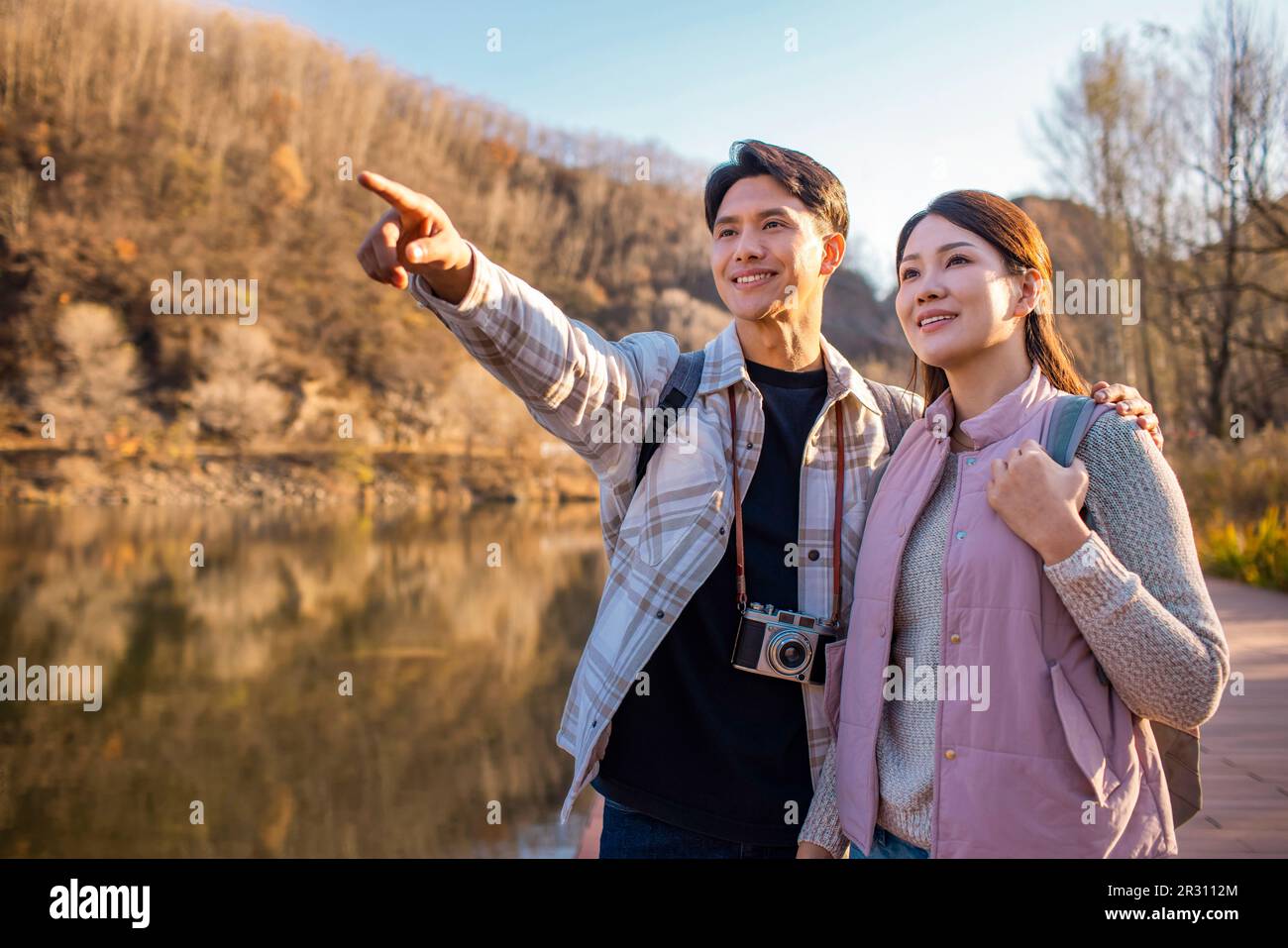 Cheerful young couple enjoying the beautiful natural scenery Stock ...