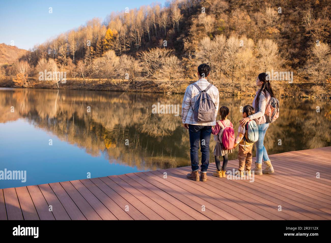 Cheerful young family enjoying the beautiful natural scenery Stock ...