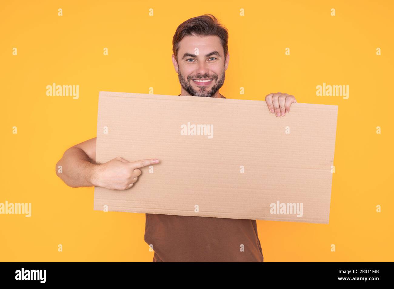 Man holds sign, blank card. Placard ready for your product. Sign to ...