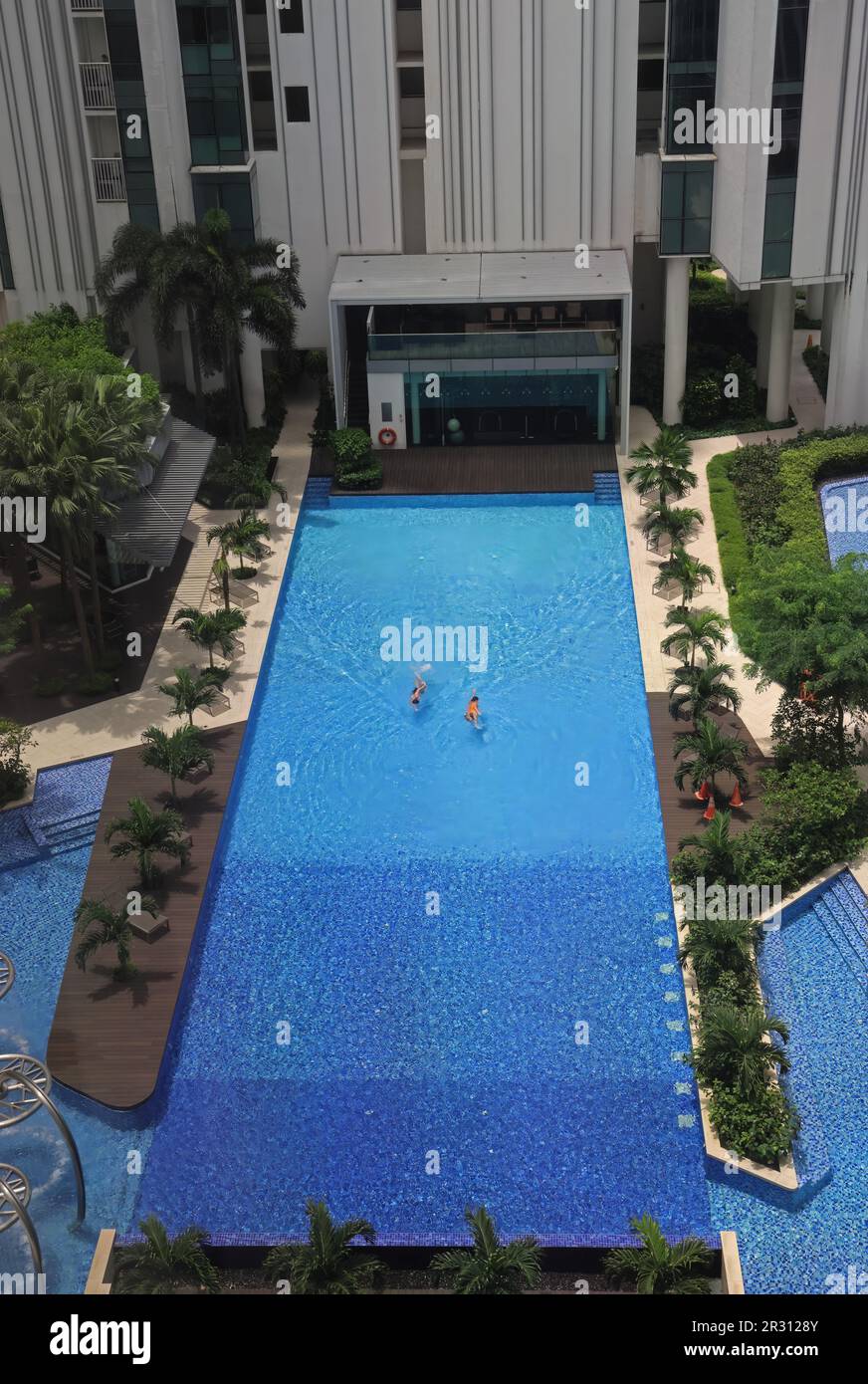 view down onto swimming pool in urban hotel Singapore April Stock Photo ...