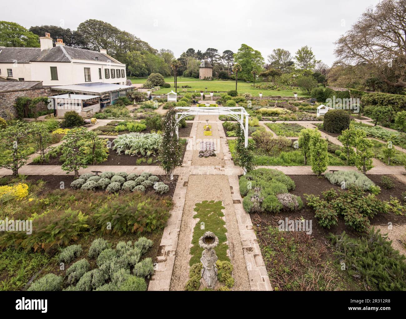 The long view towards the ancient, thatched, Colombier at Samares Manor ...