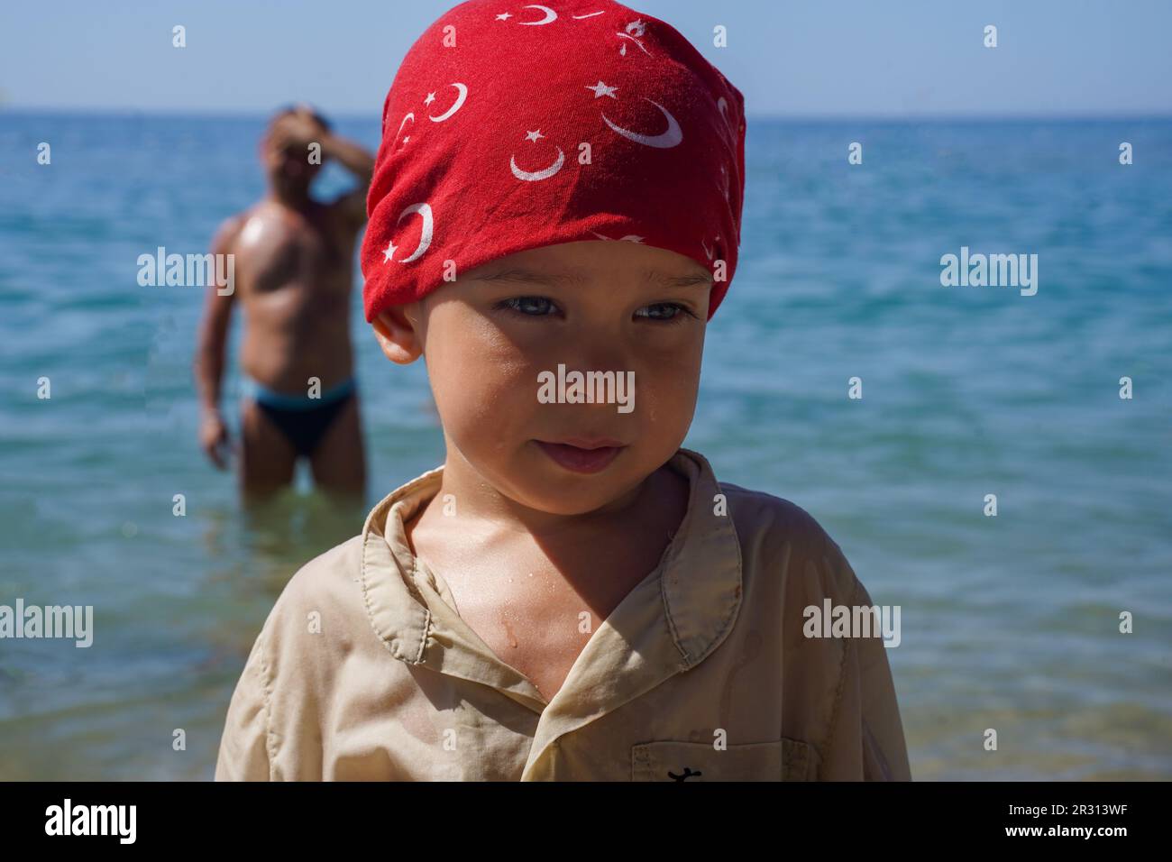 Crying resentful child close-up, and compassionate father in the ...