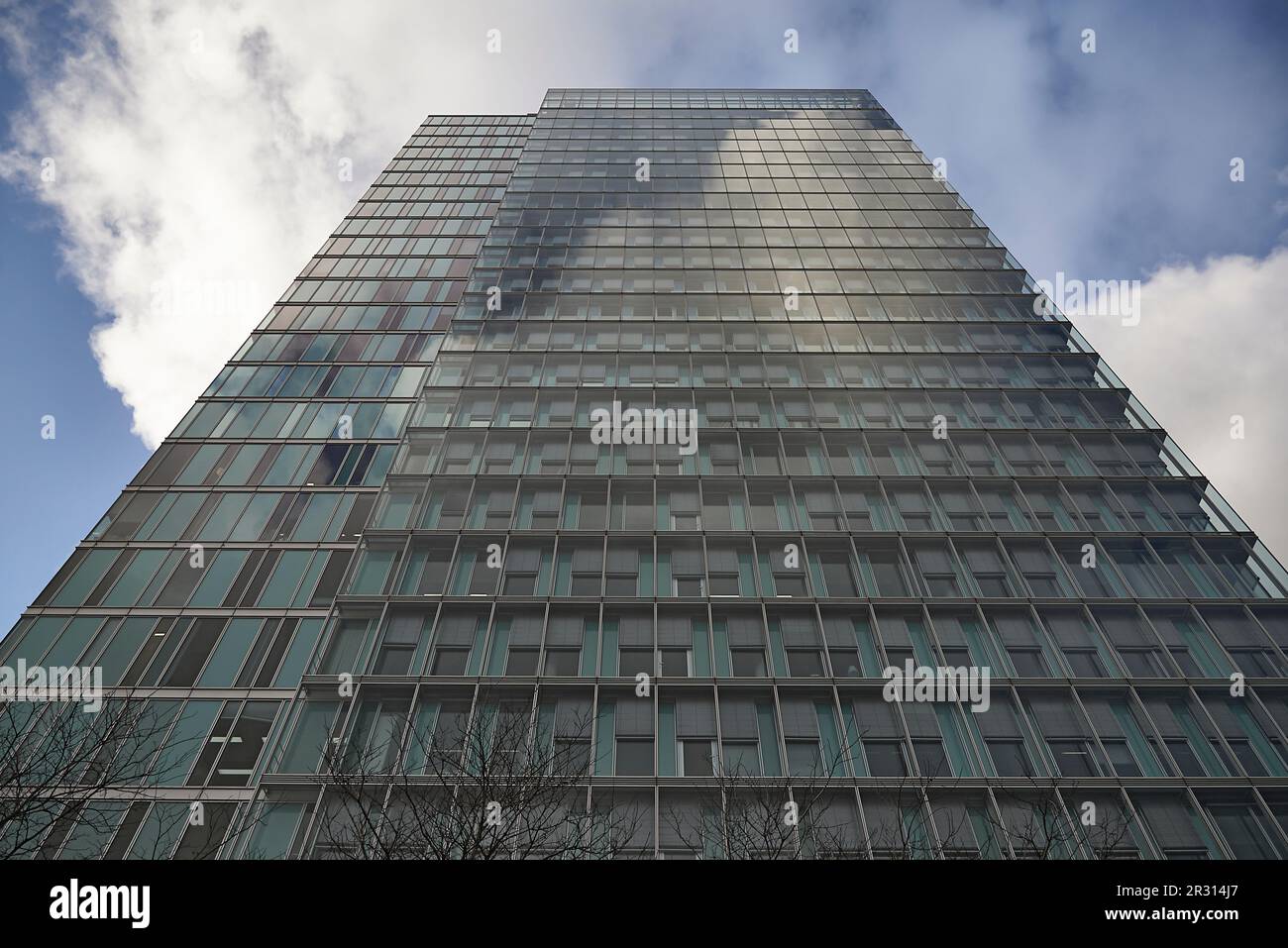 Reflective glass windows on the facade of a high rise office building ...
