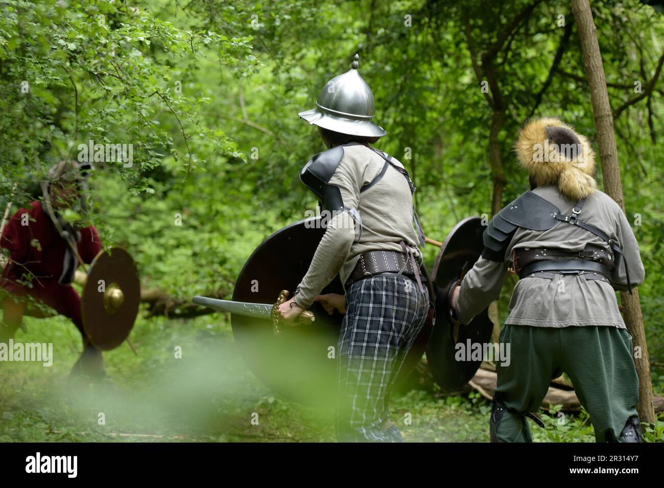 view of a medieval role-playing game in the forest in France Stock ...