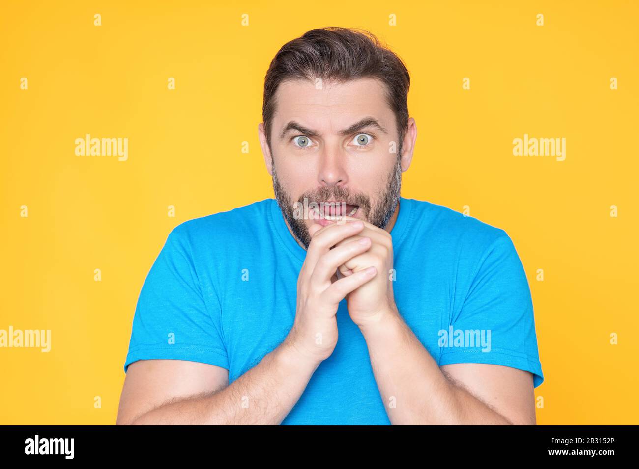 Emotional scared man looks with frightened expression, nervously ...