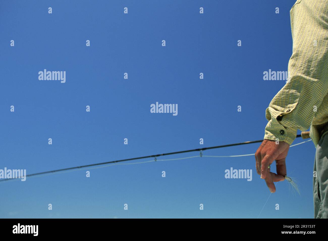 An anonymous fly-fisherman ready to fish in the Bahamas Stock Photo - Alamy