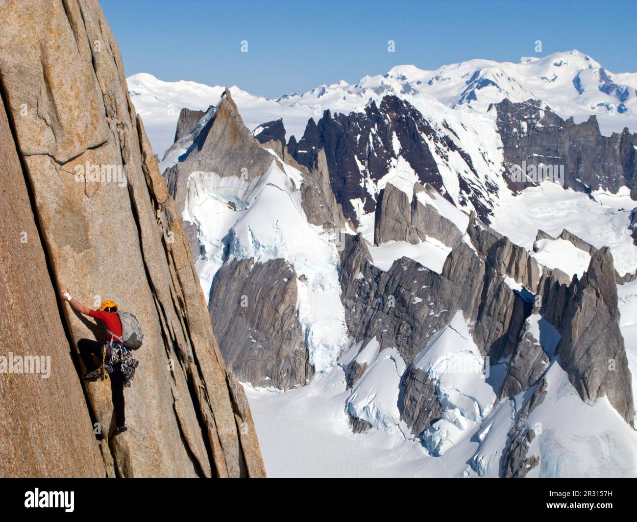 A climber ascends a crack in smooth granite on the north pillar of ...