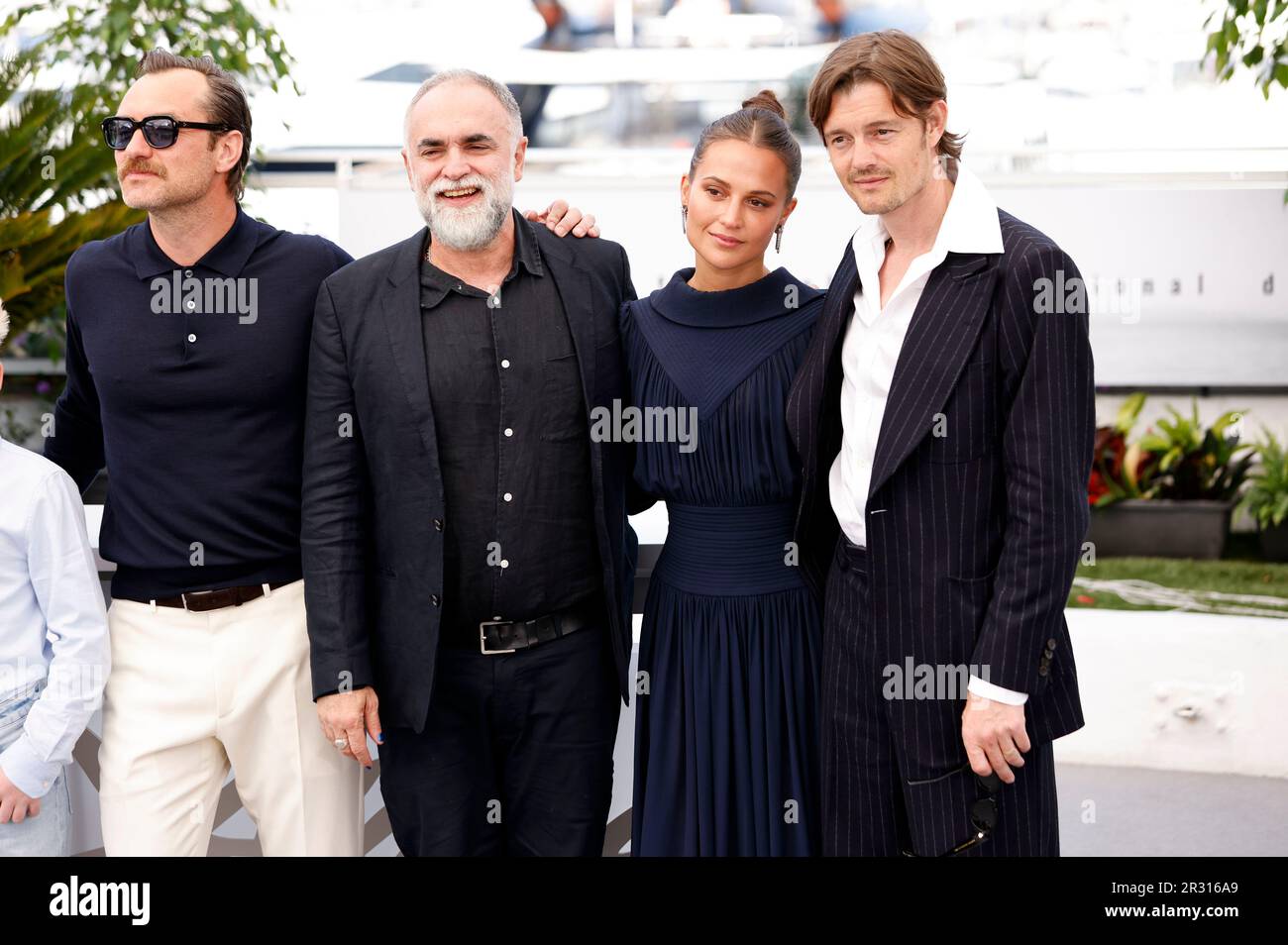 Cannes, France. 22nd May, 2023. Jude Law, Karim Ainouz, Alicia Vikander ...
