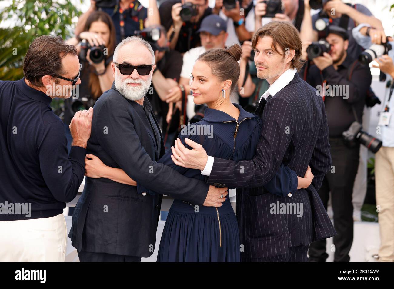 Cannes, France. 22nd May, 2023. Jude Law, Karim Ainouz, Alicia Vikander ...