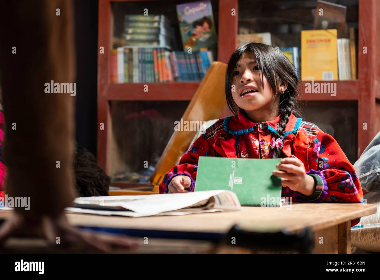 Peruvian Andean girl observes her teacher at school Stock Photo - Alamy