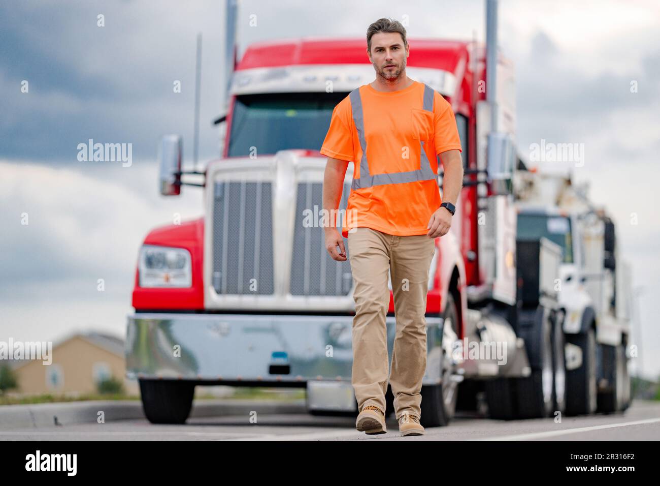 Men driver near lorry truck. Man owner truck driver in safety vest near ...