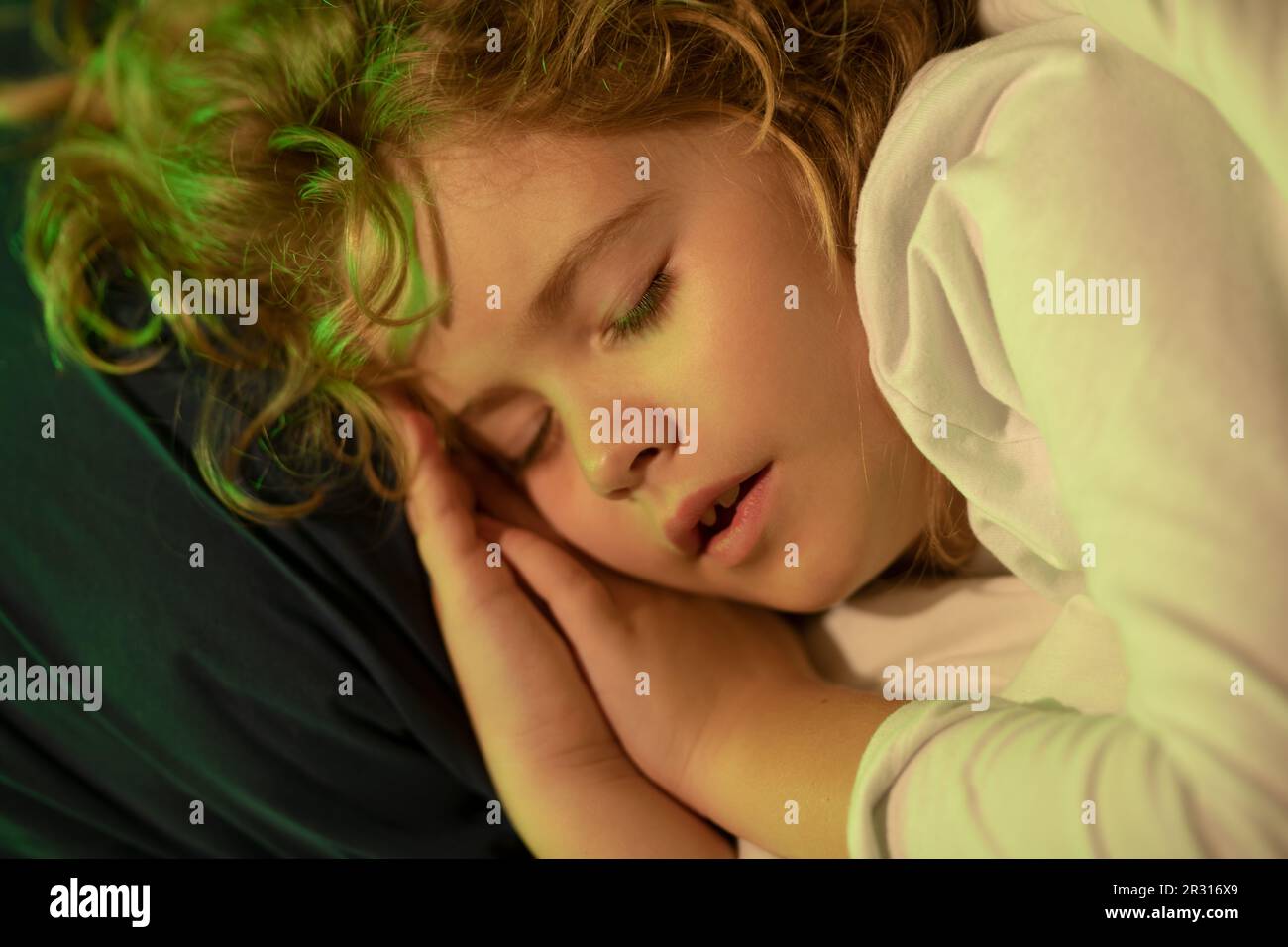Quiet sleep. Little kid sleeps on bed, napping. Cute child sleeping ...