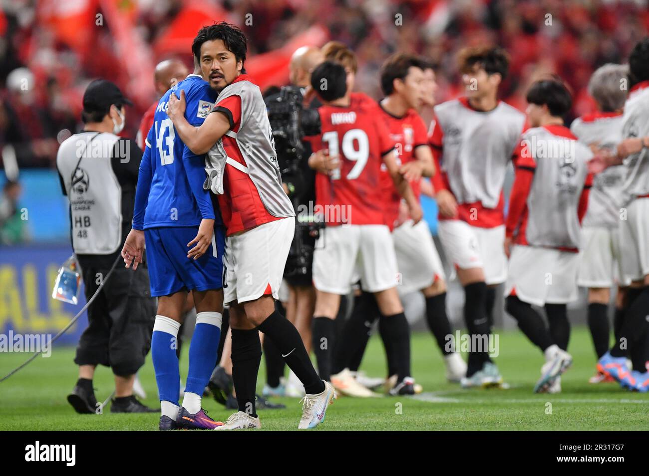 Saitama, Japan. 6th May, 2023. Urawa Reds' Shinzo Koroki, right, hugs Al-Hilal's Musab Al-Juwayr ...