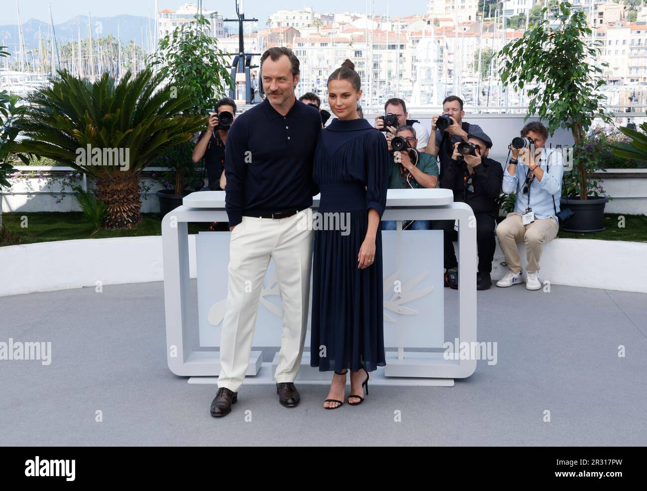 Jude Law, left, and Alicia Vikander pose for photographers at the photo ...