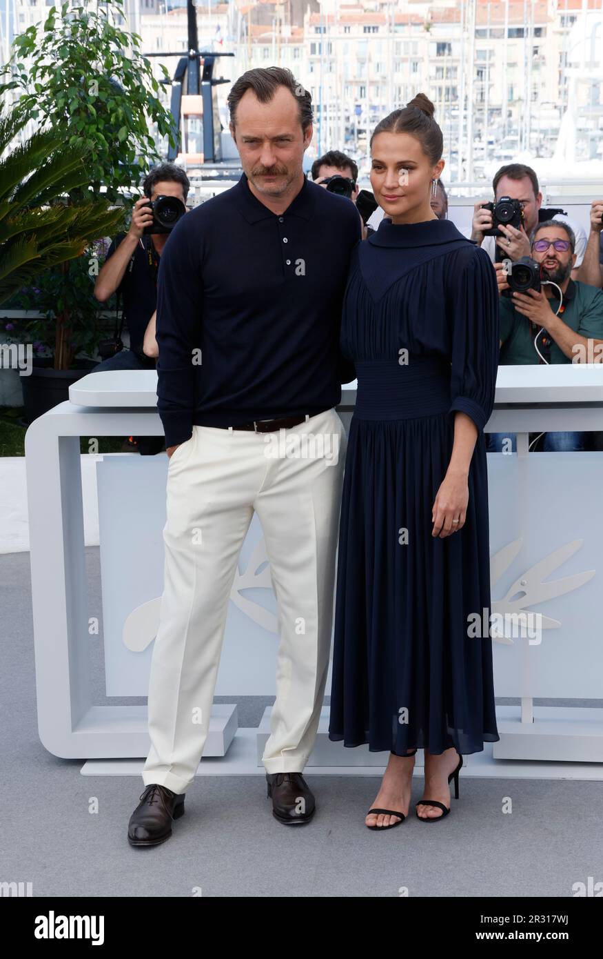 Jude Law, left, and Alicia Vikander pose for photographers at the photo ...