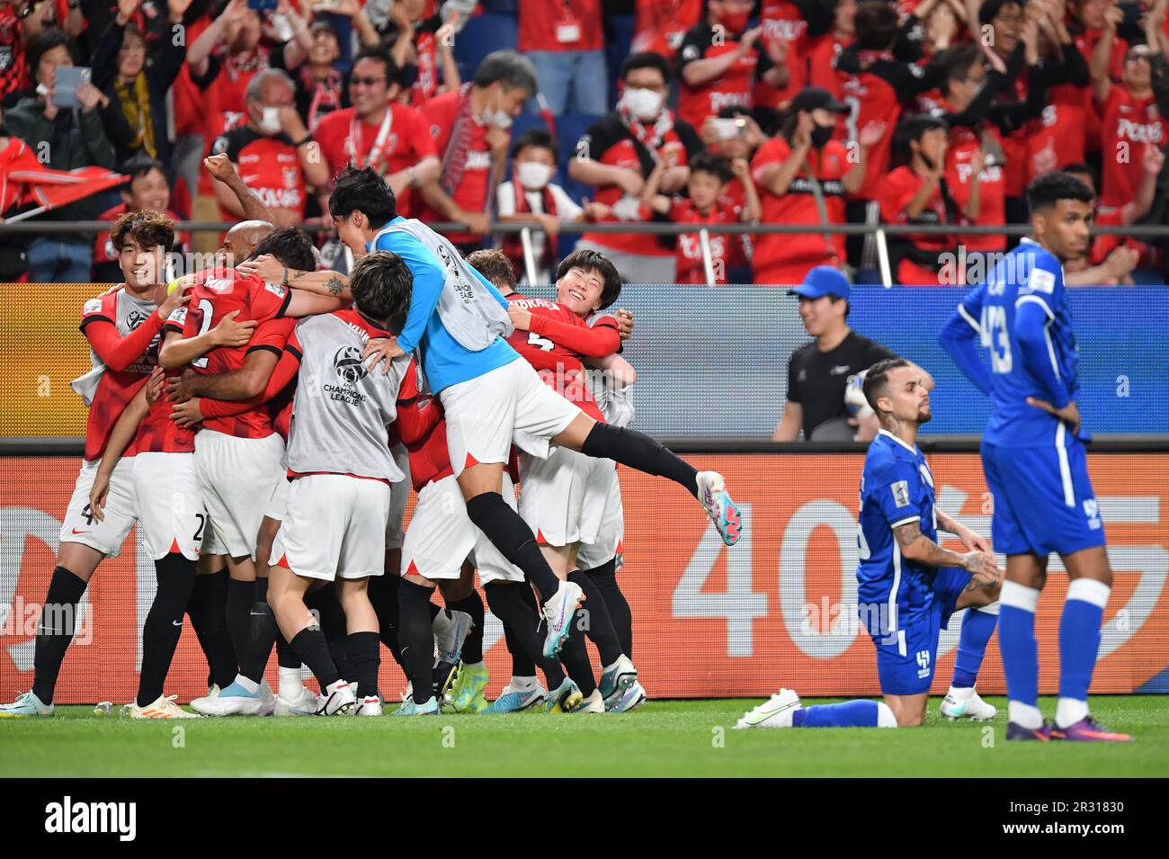 Urawa Reds players celebrate victory as Al-Hilal players look dejected ...