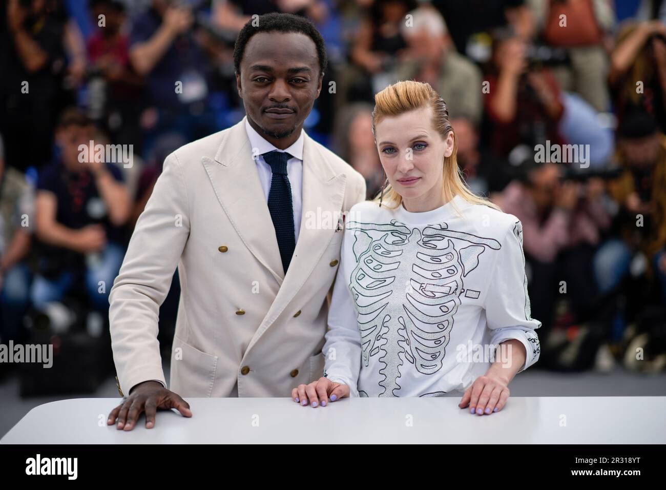 Marc Zinga, left, and Lucie Debay pose for photographers at the photo ...