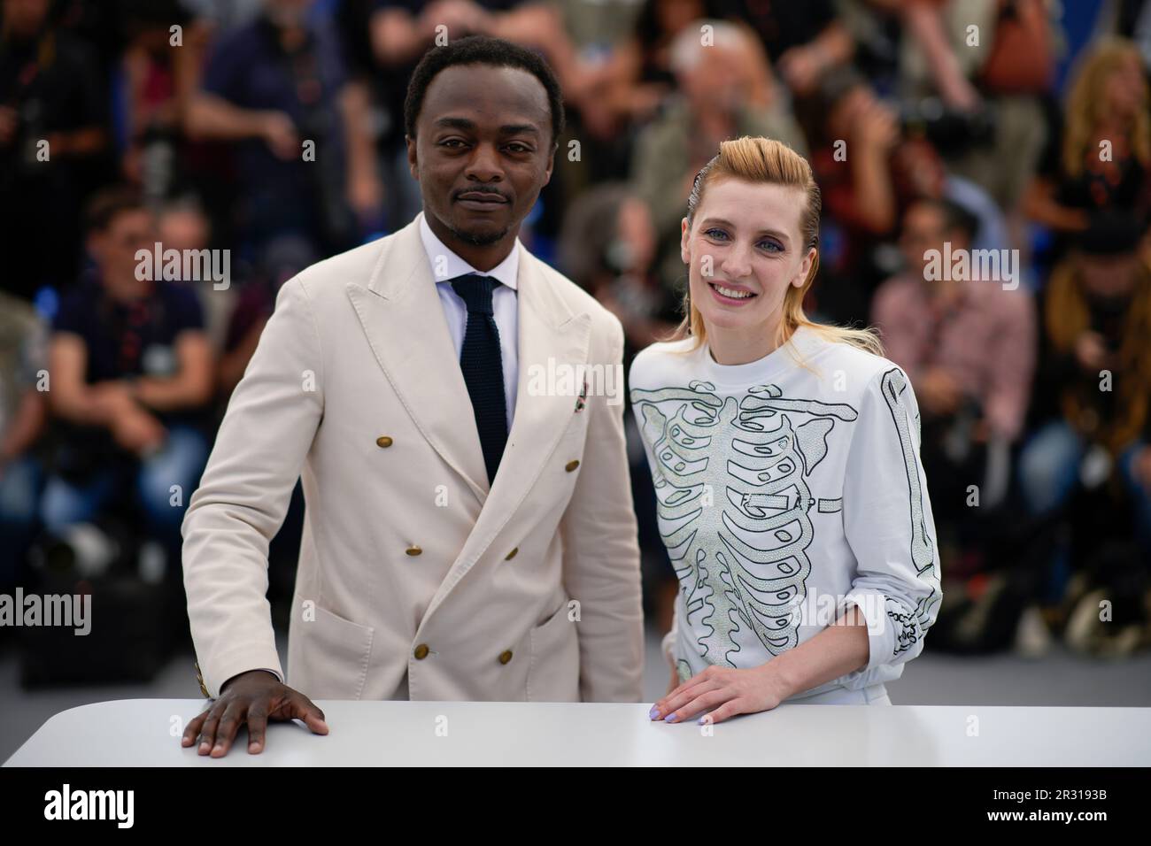 Marc Zinga, left, and Lucie Debay pose for photographers at the photo ...