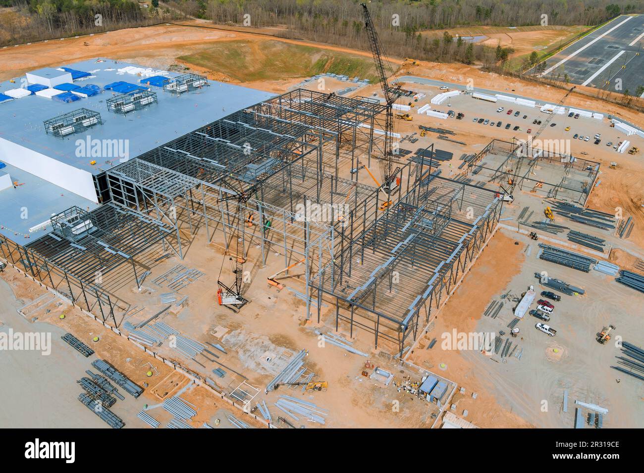 Installing metal frame for steel warehouse construction frame work ...