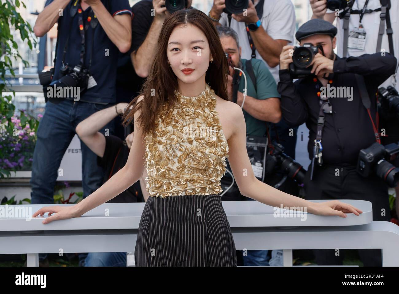 Dongyu Zhou poses for photographers at the photo call for the film 'The ...