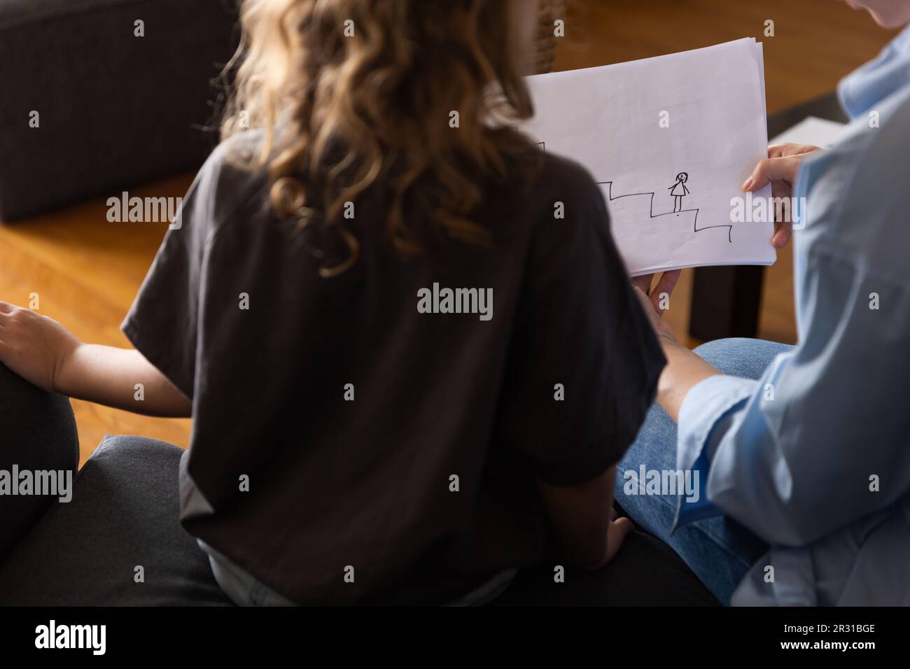 A girl at a psychologist's appointment draws a test drawing, low self ...